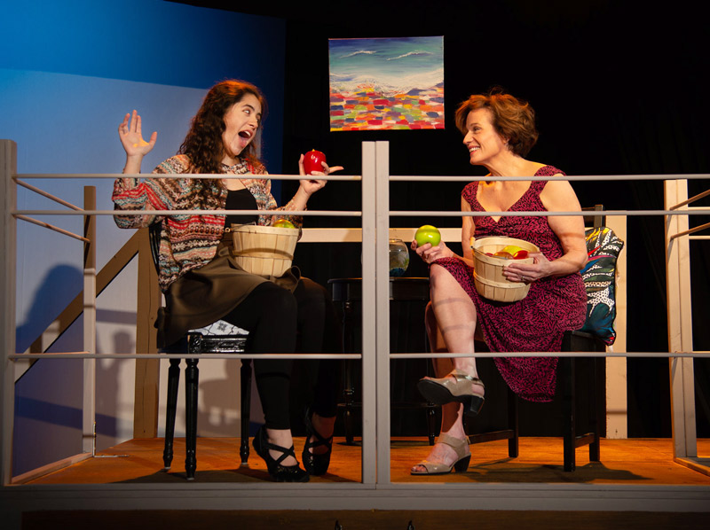 Matilde and Ana sort apples in The Clean House, 2018 | Commonweal Theatre